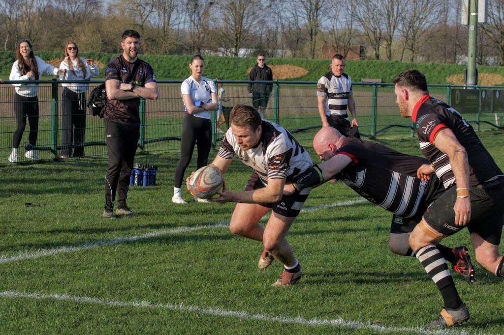 Aaron Booth Shines with Four Tries in Trafford MV Win